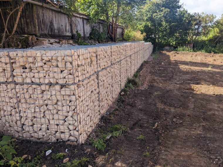 The Design and Installation of a Gabion Retaining Wall to Protect a Housing Development Boundary ...